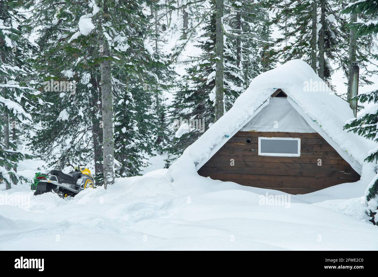Minimalist winter landscape with wooden house in snowy mountains ...