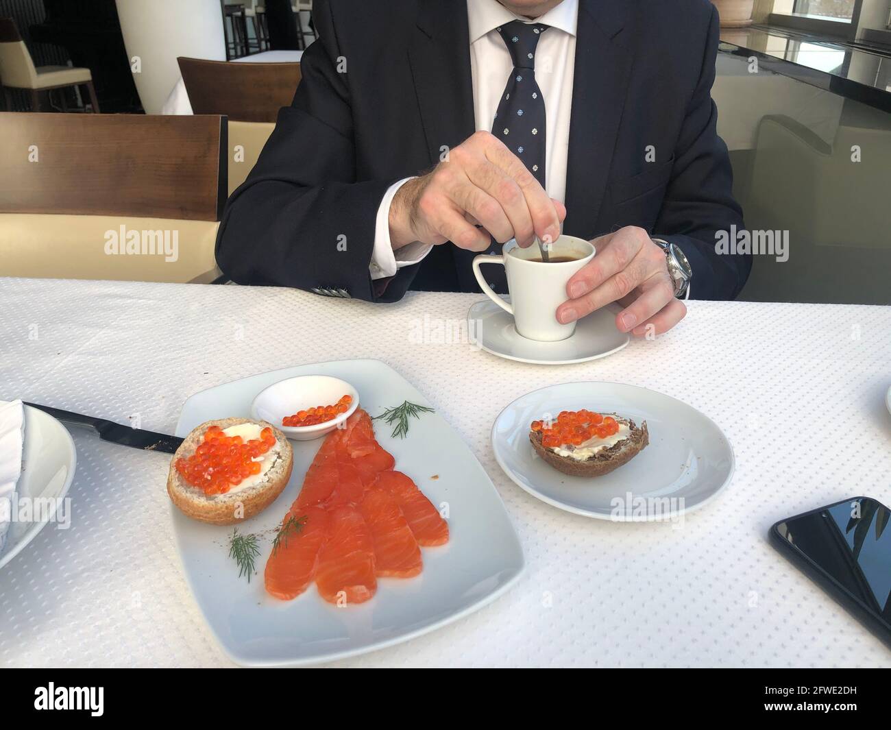 Business man eating snack walking hi-res stock photography and images ...