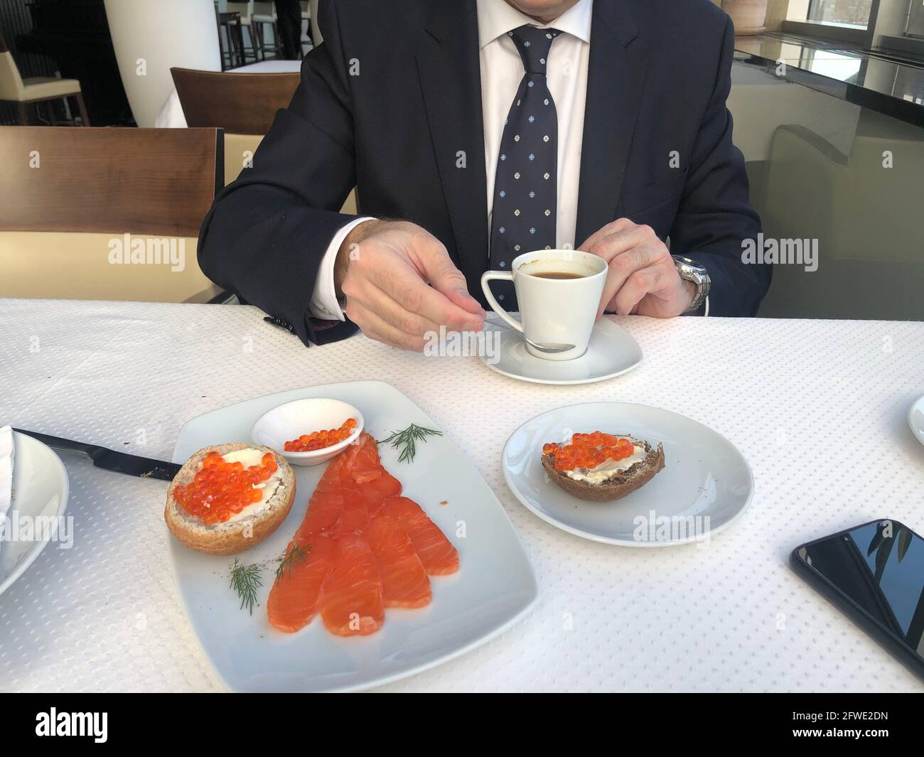 Business man eating snack walking hi-res stock photography and images ...