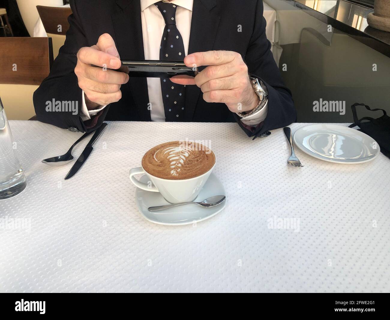 Man eating dinner suit hi-res stock photography and images - Alamy
