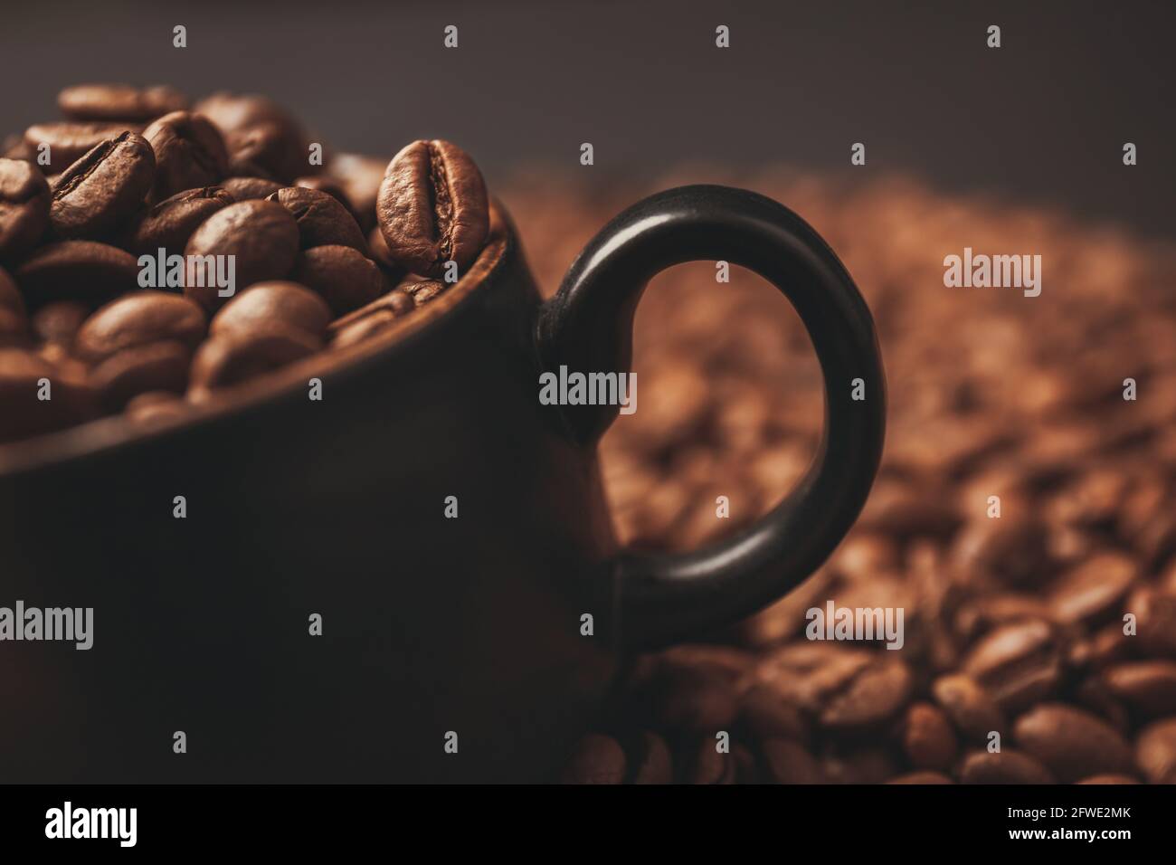 Coffee cup full with coffee beans, close up shoot. Coffee background ...