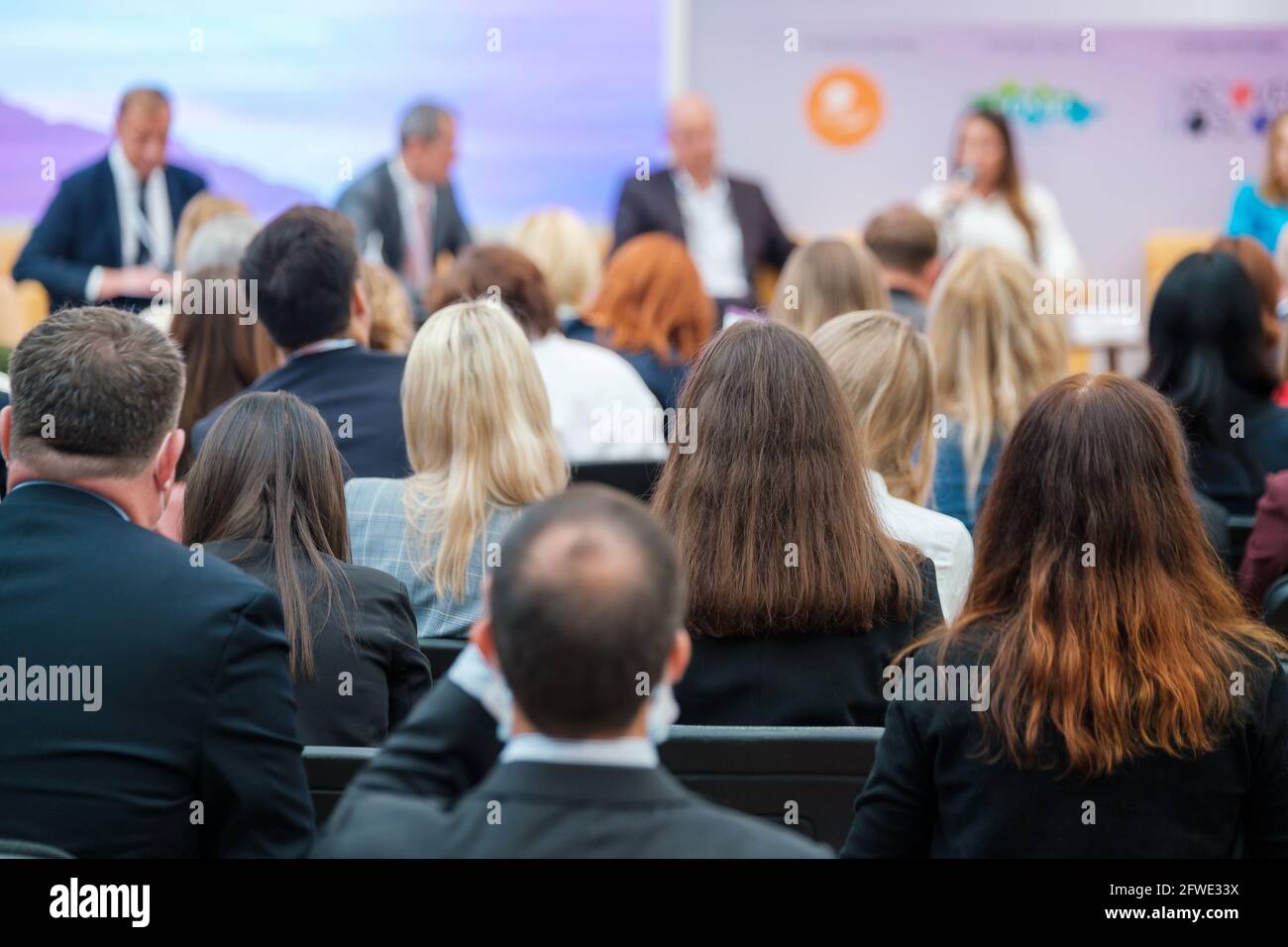Businesspeople listening speaker during conference hi-res stock ...