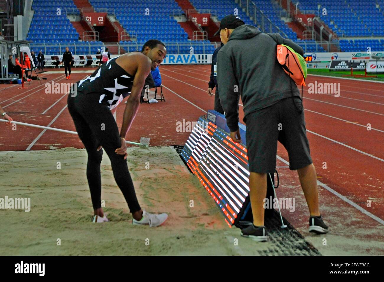 Christian Taylor (USA), left, talks with coach Rana Reider after ...