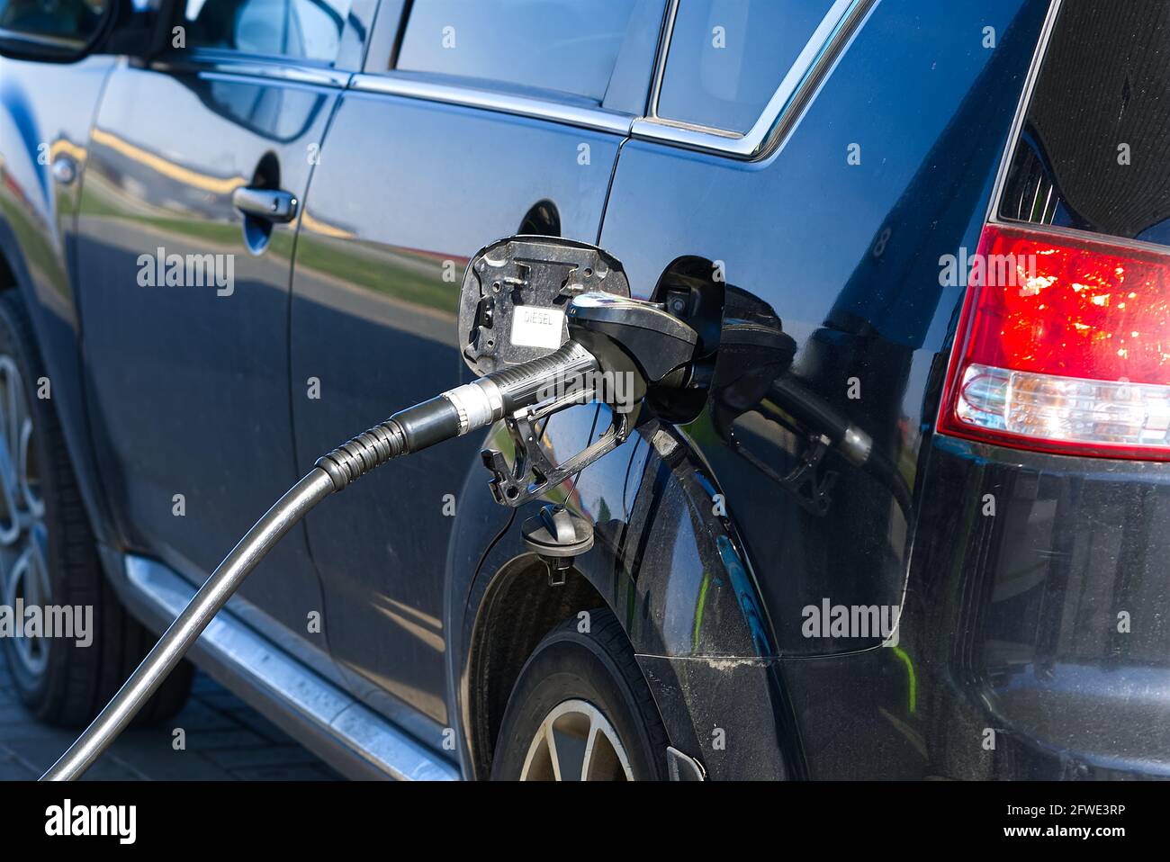 close-up refilling the black car with a diesel with gas pump Stock ...