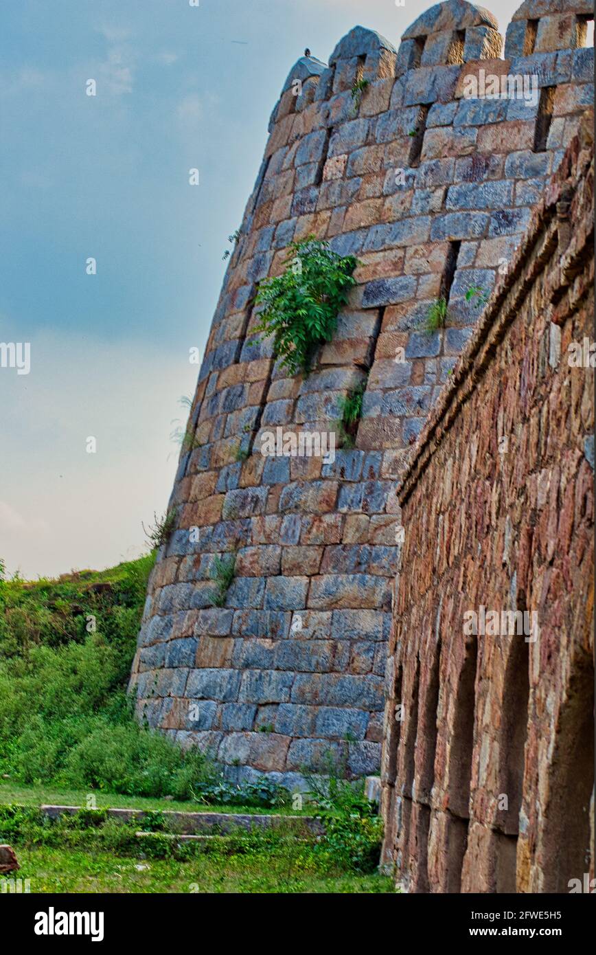 Portrait view of the ruins of side wall of Tughlaqabad fort Stock Photo ...