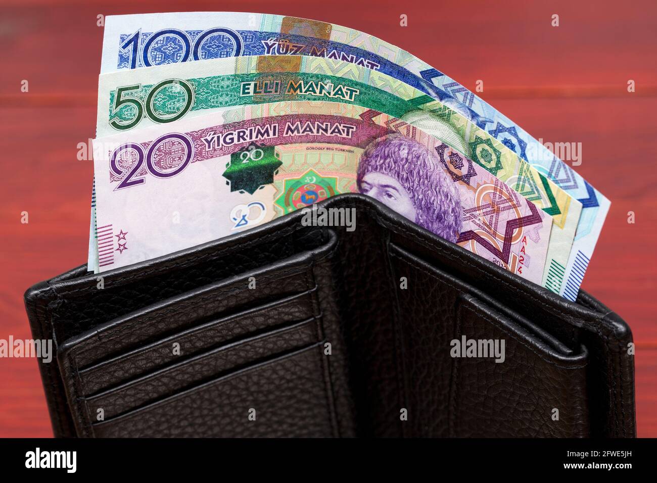 Turkmenistani money - manat in the wallet Stock Photo - Alamy