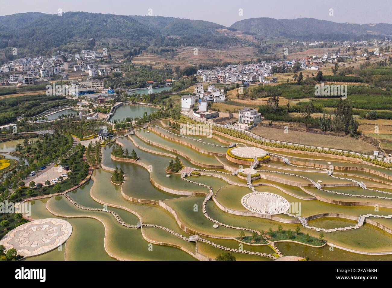 Aerial view of artificial rice terraces in Jinpingshan park in Mile ...