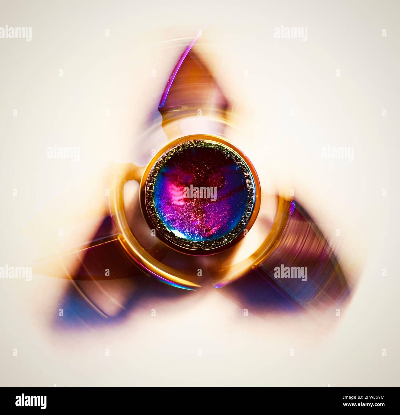 Fidget spinner on white background Stock Photo - Alamy