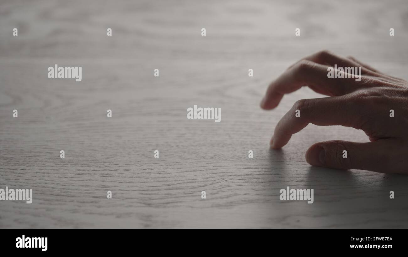 Closeup man hand finger tapping oak wood surface, wide photo Stock ...