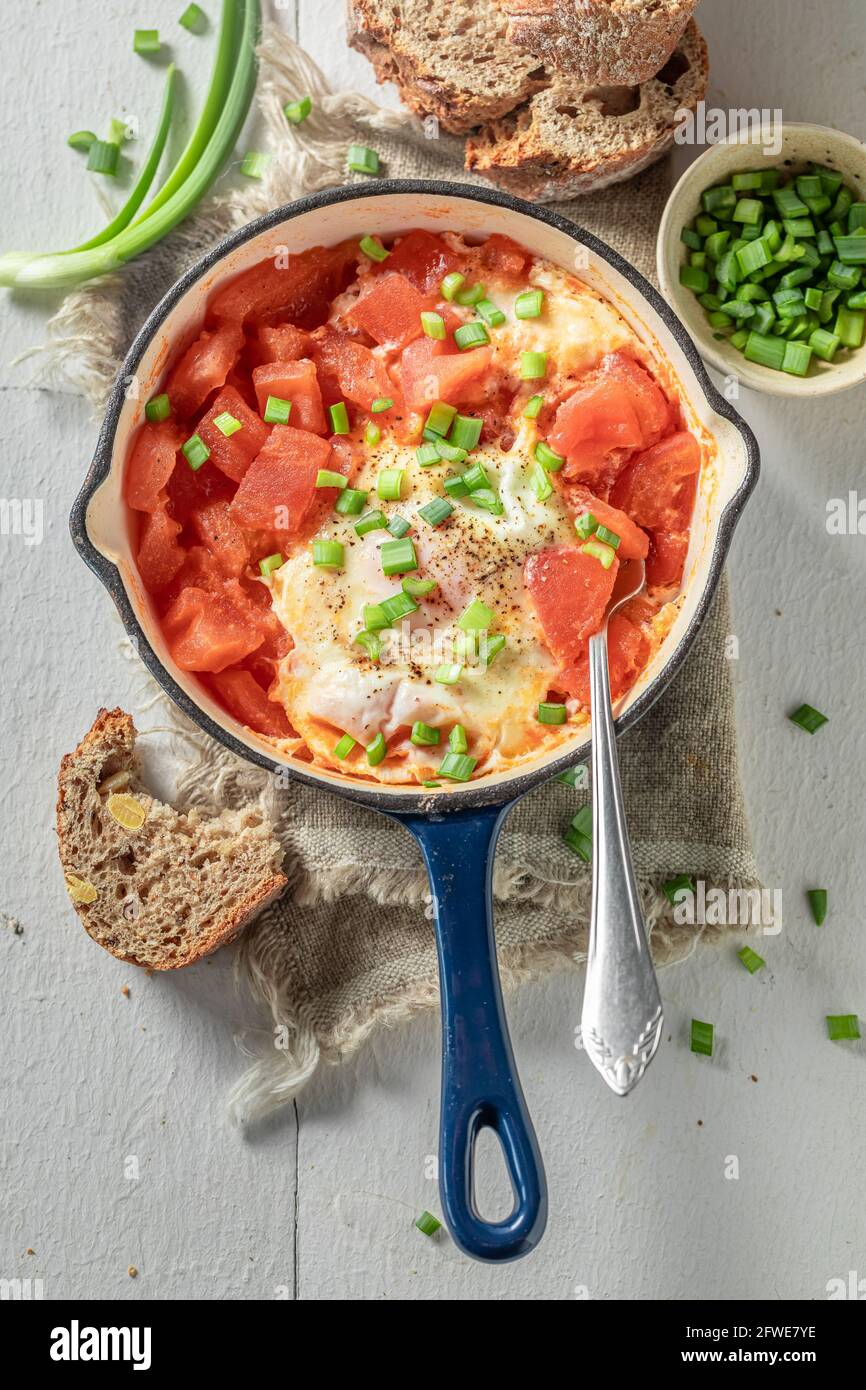 Homemade shakshuka served with wholemeal bread. Tunisian cuisine ...