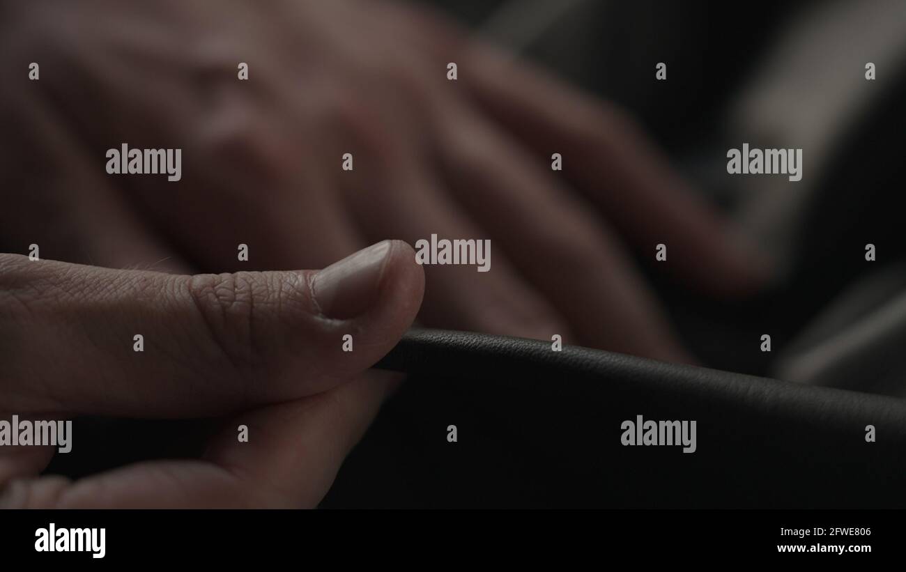 Man hand touching soft leather with sun shining from a window, wide ...