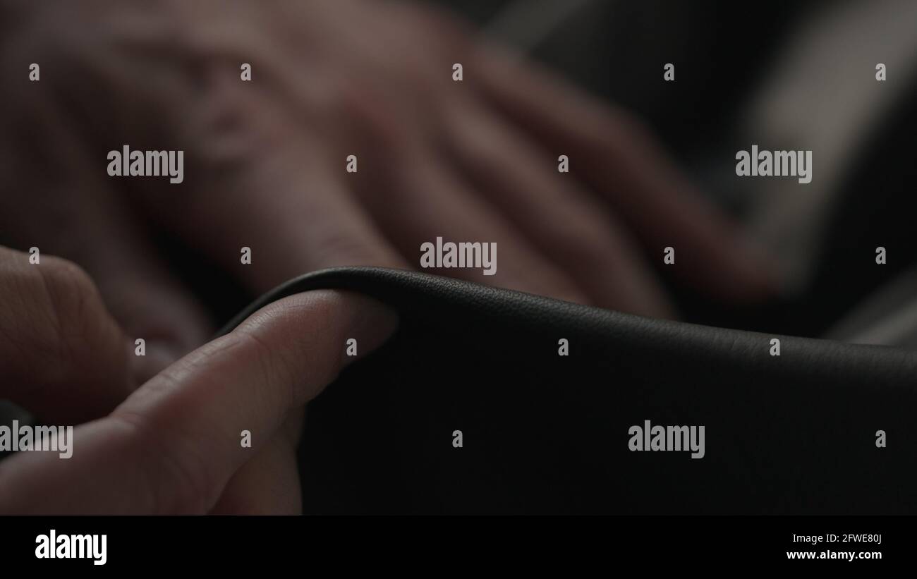 Man hand touching soft leather with sun shining from a window, wide ...