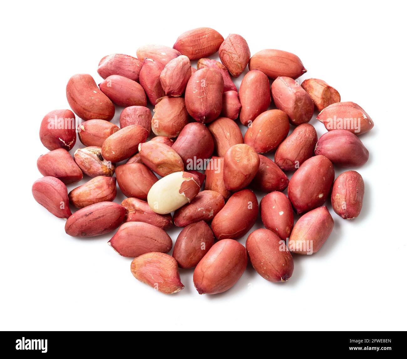pile of unpeeled peanuts closeup on white background Stock Photo - Alamy