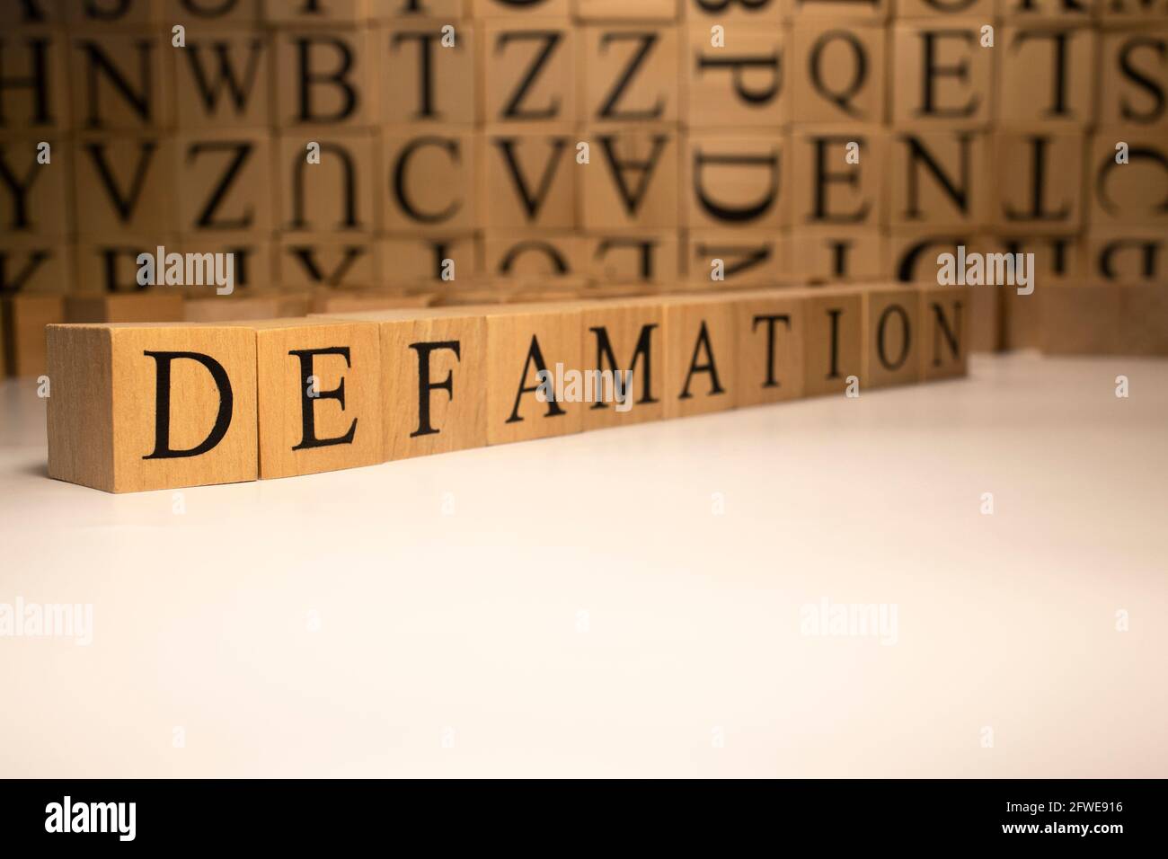 The word defamation end was created from wooden cubes. Countries and ...