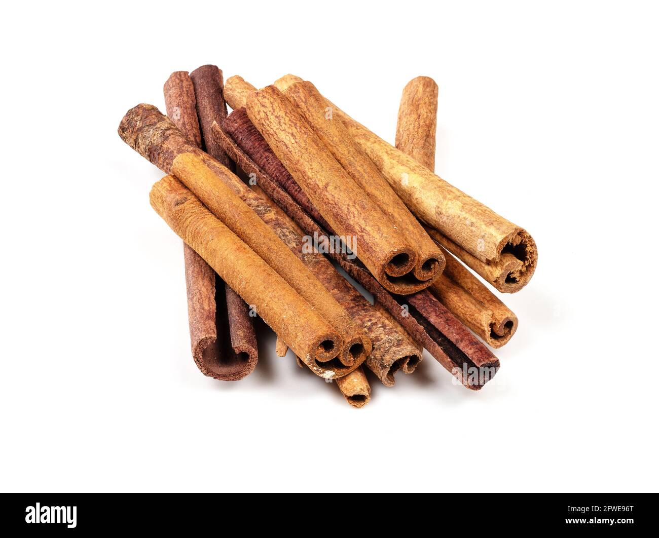 pile of chinese cinnamon (Cassia) sticks closeup on white background ...