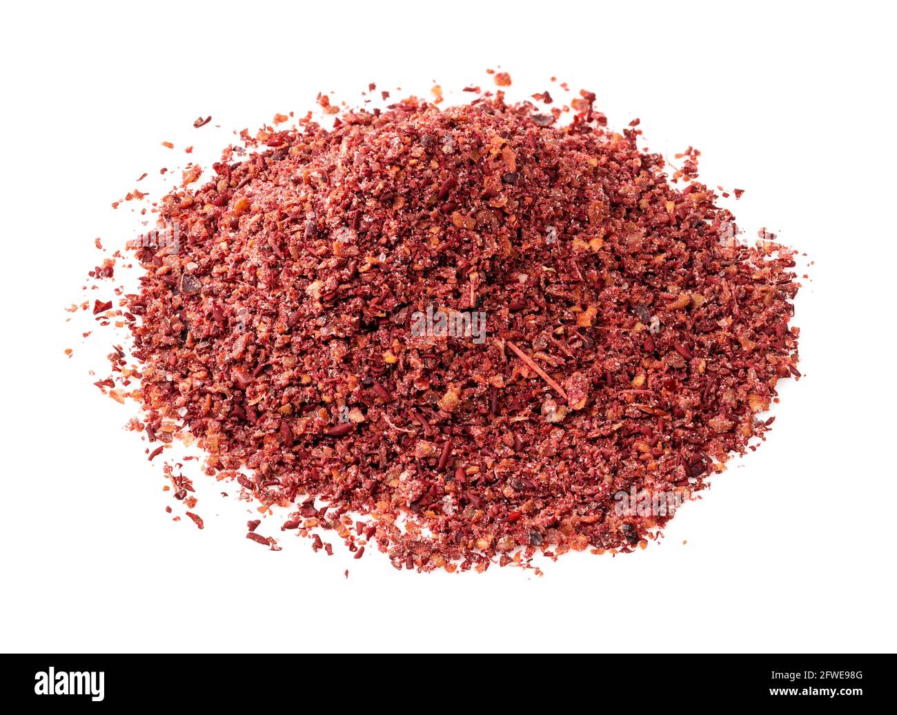 pile of sumac powder closeup on white background Stock Photo - Alamy
