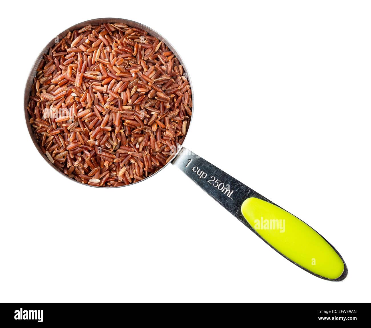 top view of raw red rice in measuring cup cutout on white background ...