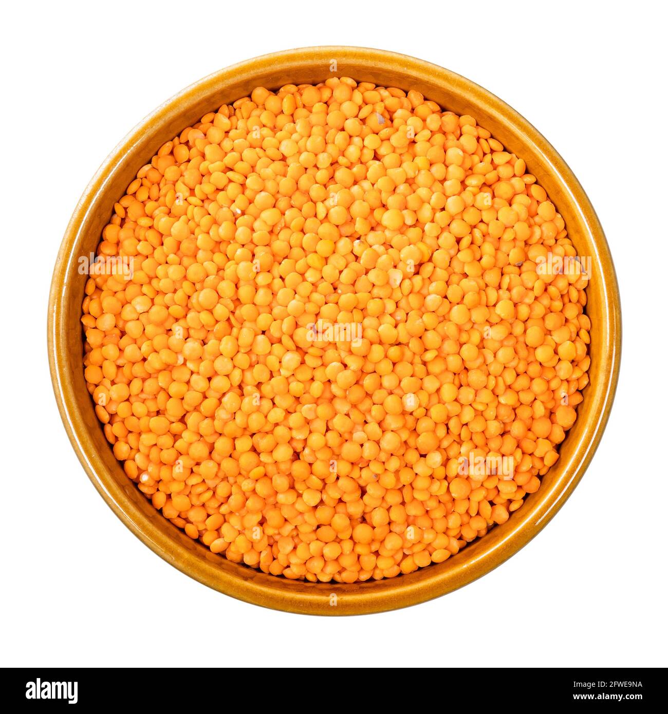 top view of whole red lentils in round bowl cutout on white background ...