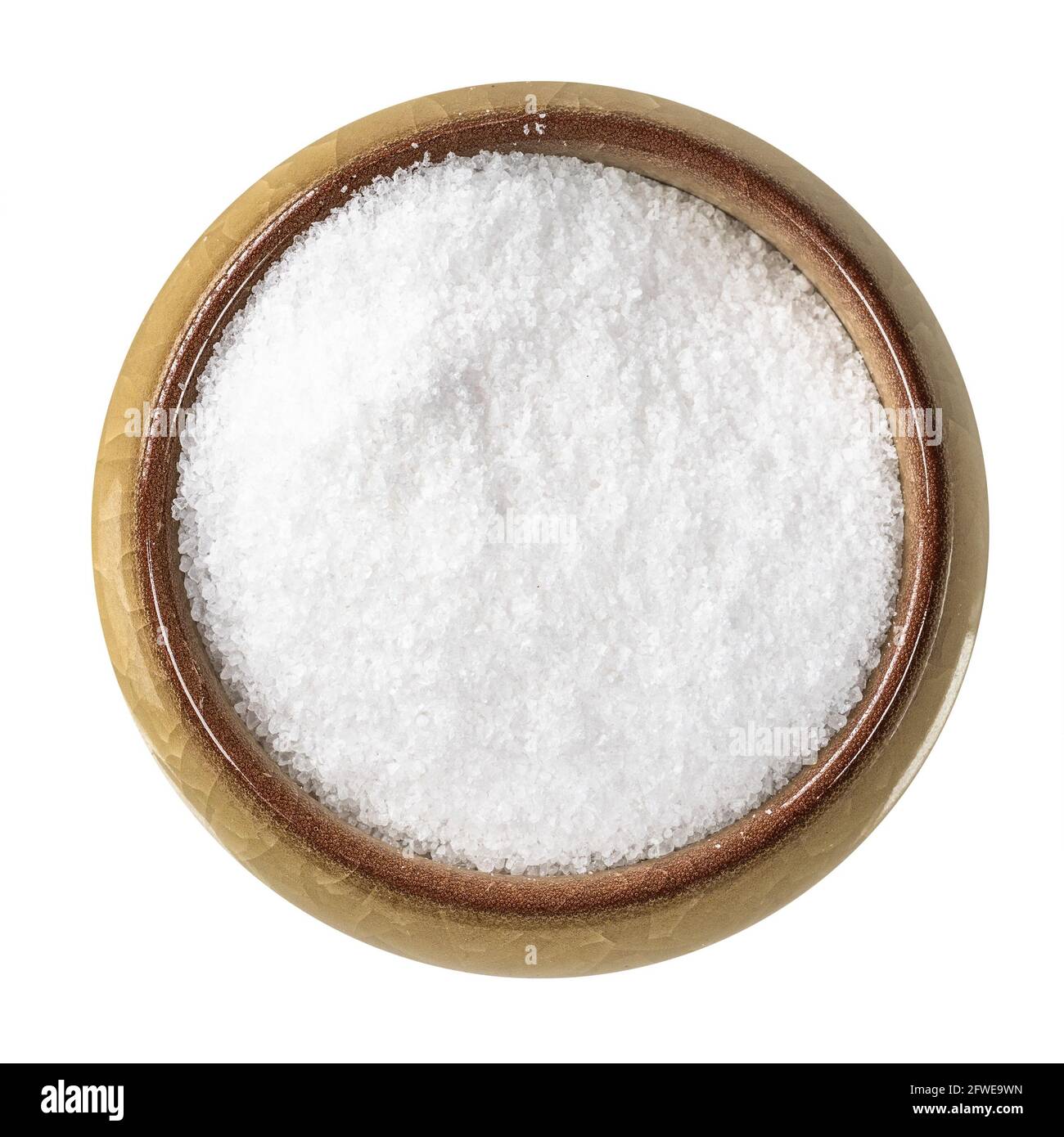 top view of finely ground sea salt in ceramic bowl cutout on white ...