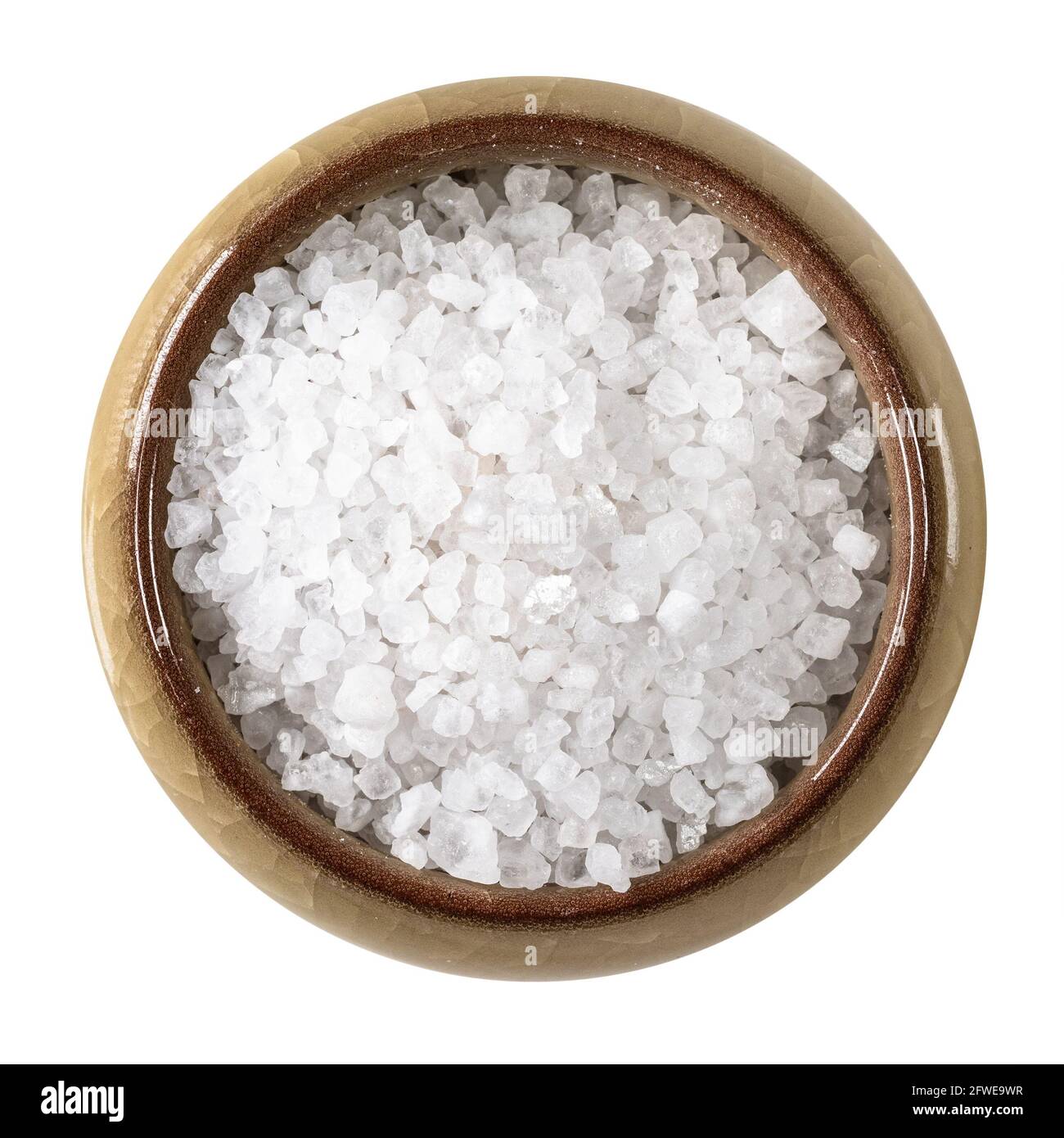 top view of coarse sea salt in ceramic bowl cutout on white background ...