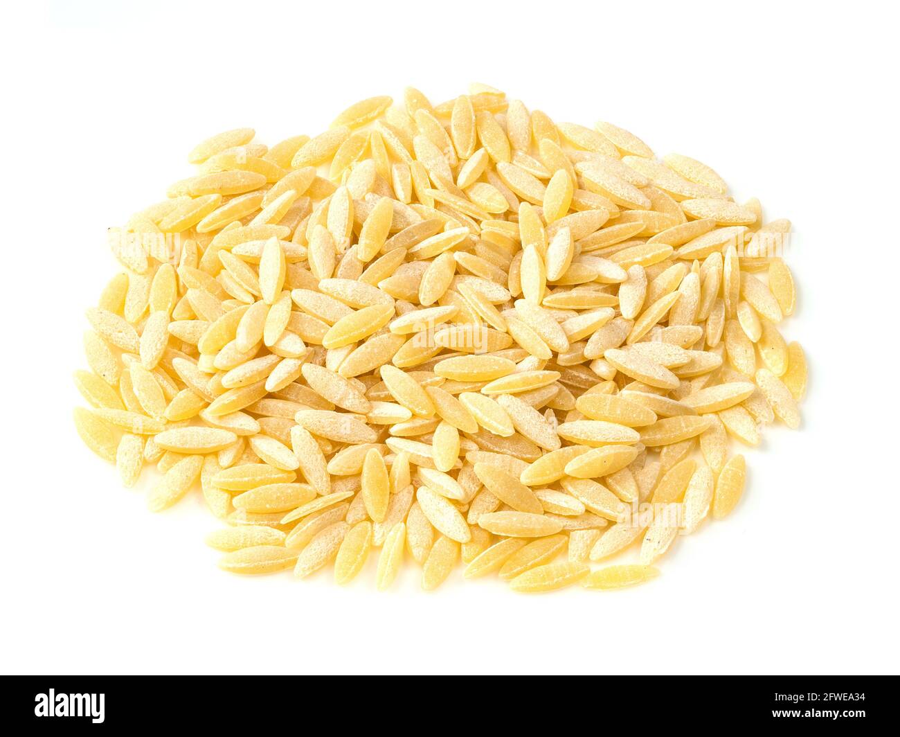 handful of uncooked risoni pastina closeup on white background Stock ...