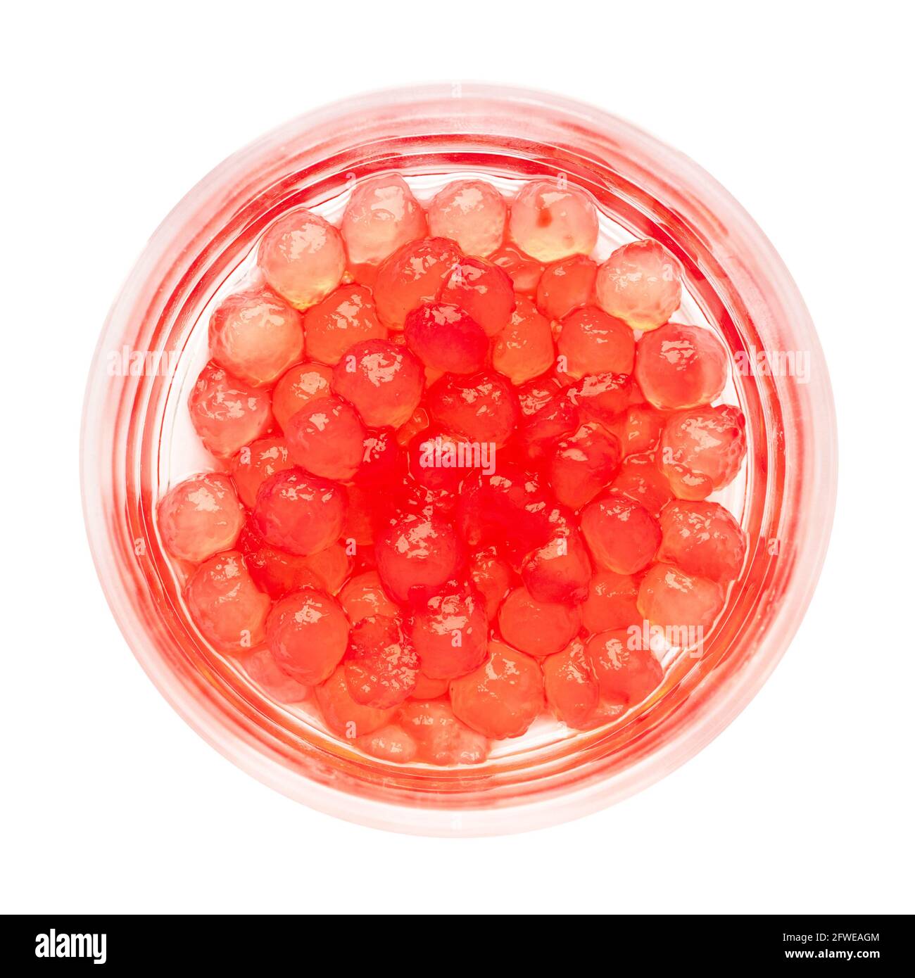 top view of red colored boiled tapioca balls in glass bowl cutout on ...