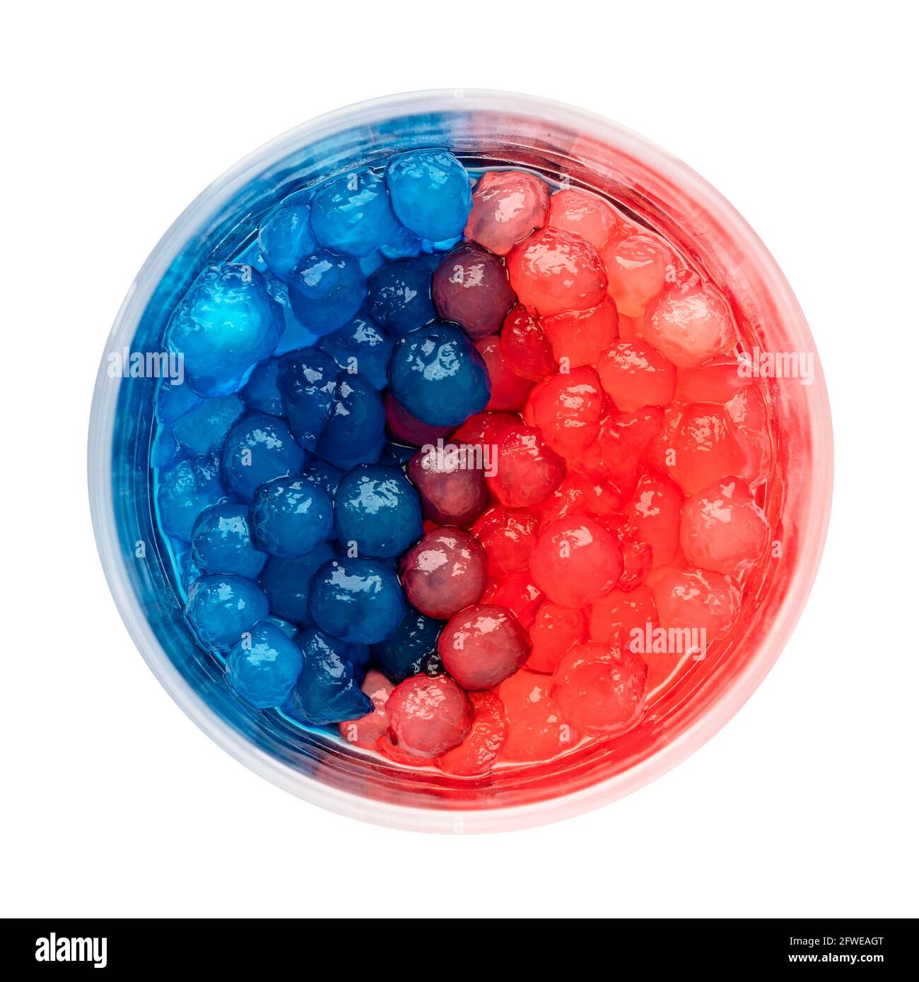 top view of red and blue colored boiled tapioca balls in glass bowl ...