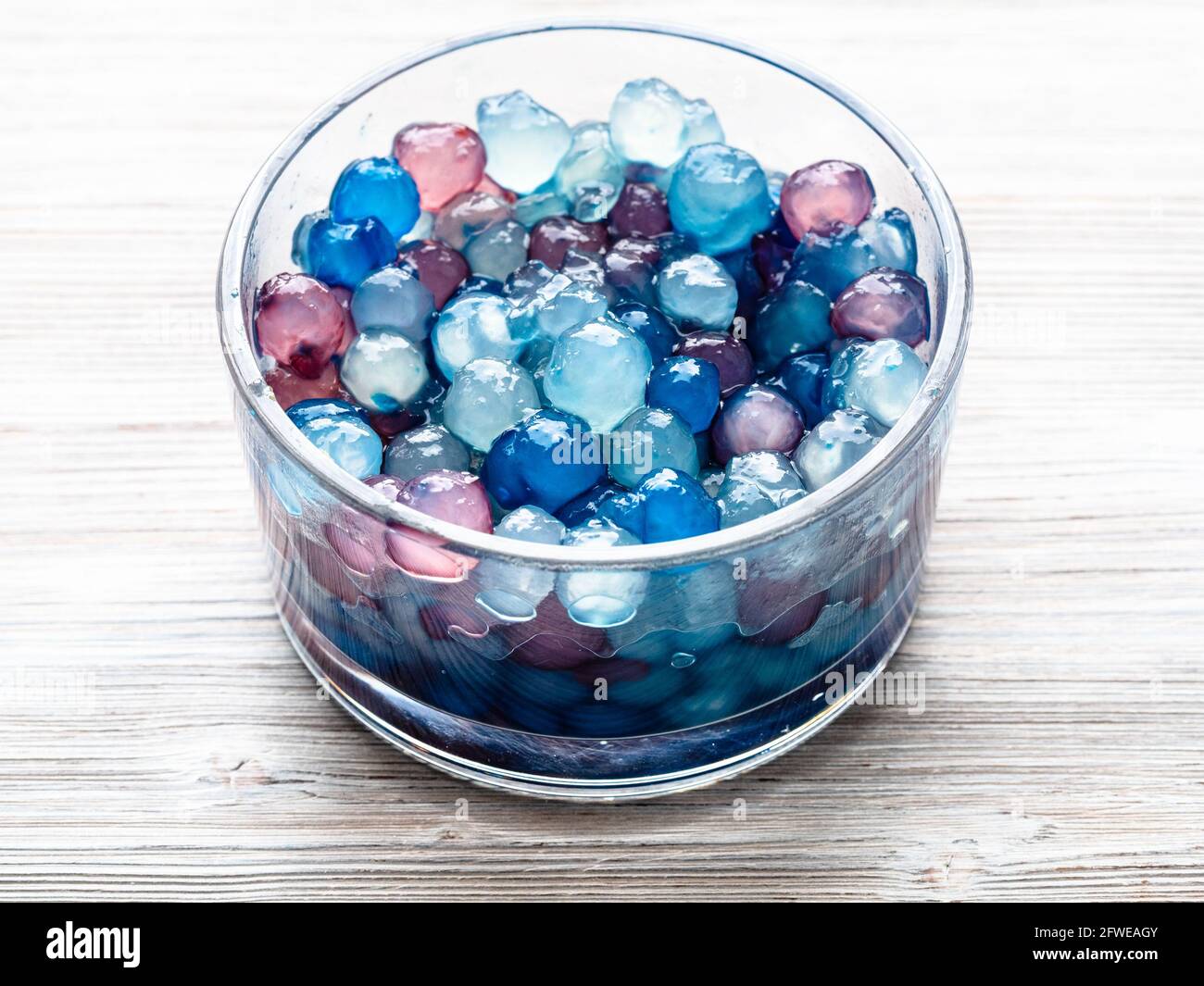 colorful boiled tapioca balls in glass bowl on gray wooden table Stock ...