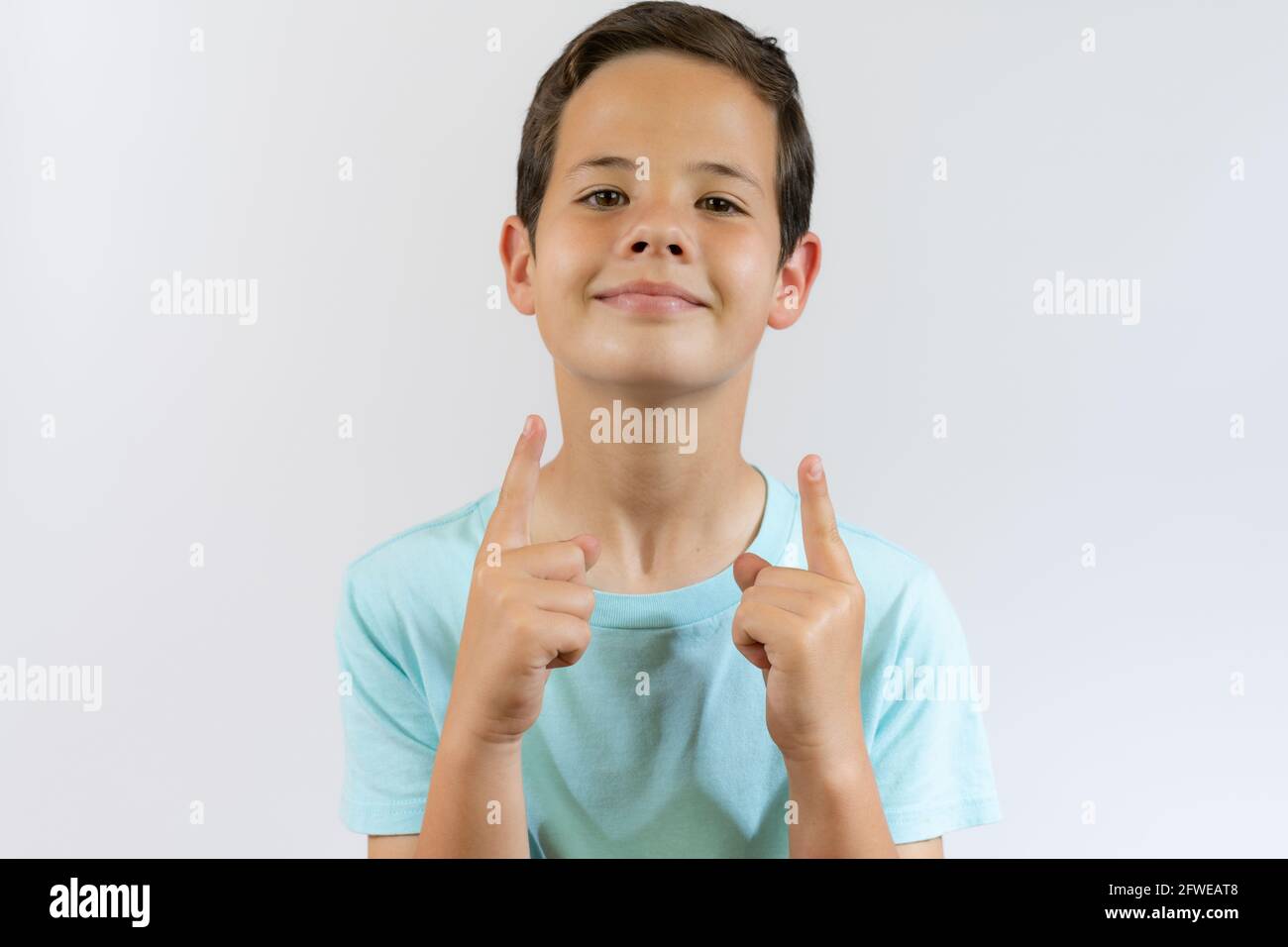 Portrait of cheerful boy with good idea - isolated over white ...