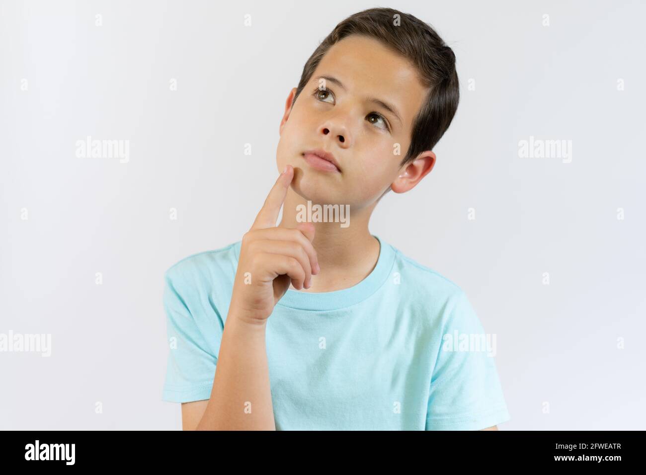 Portrait of cheerful boy with good idea - isolated over white ...