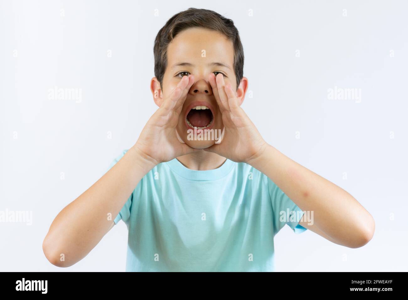 screaming teenage boy isolated on a white background Stock Photo - Alamy