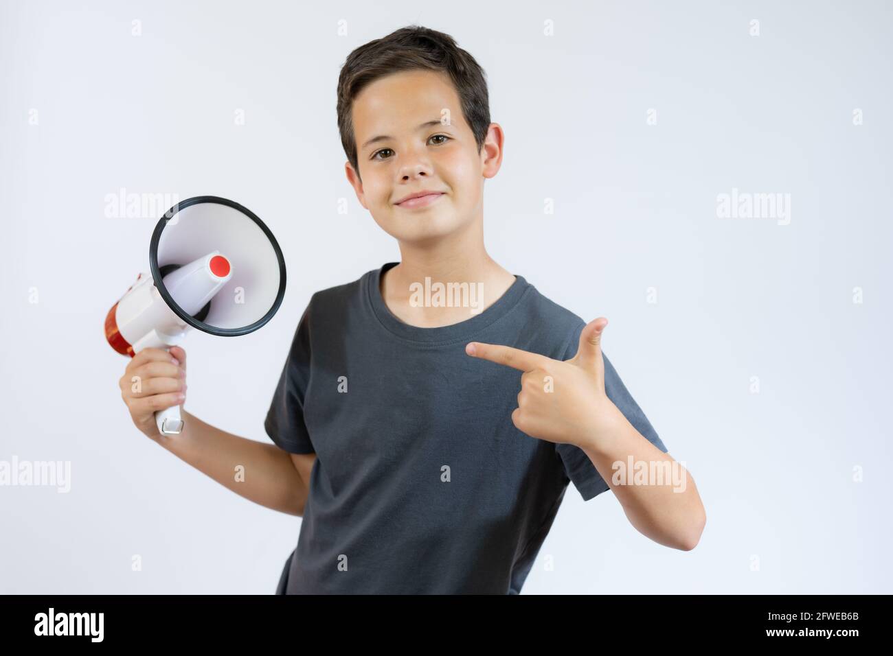 Cute little boy with megaphone on white background Stock Photo - Alamy