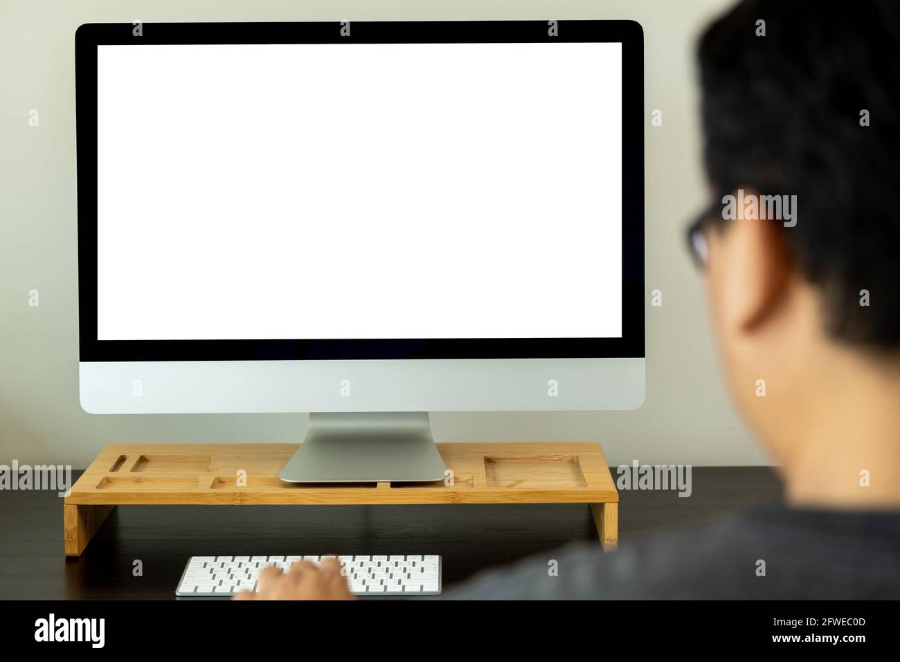 young man working Businessman using a desktop computer of the blank ...