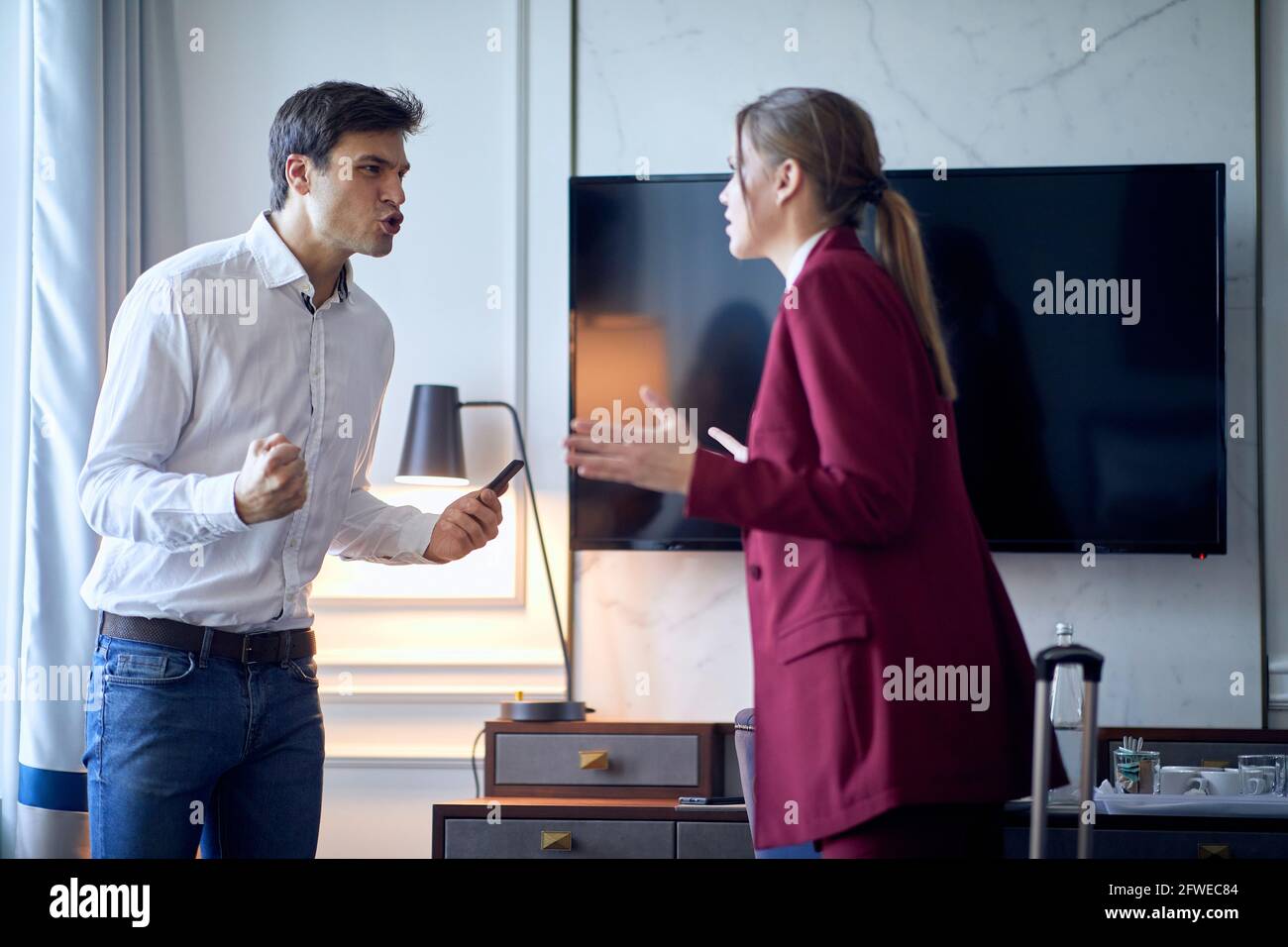 young business couple arguing in hotel room Stock Photo - Alamy