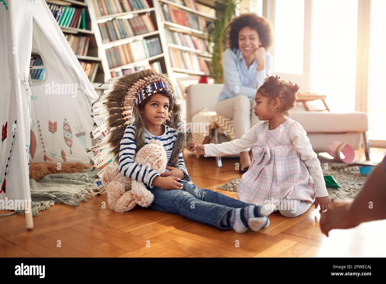 Kids spending a quality time with their Mom in a family atmosphere at ...