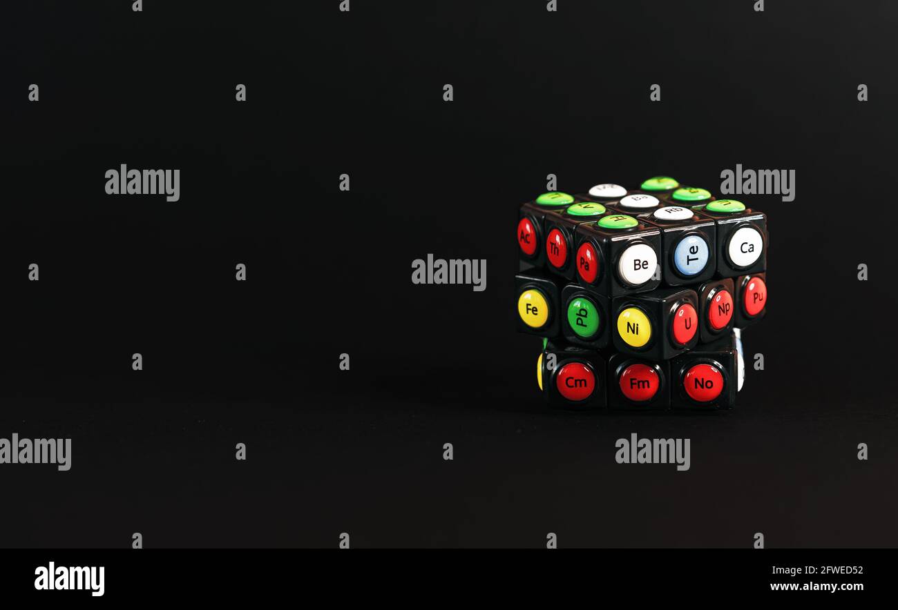 Six-color puzzle cube with chemical elements Stock Photo - Alamy