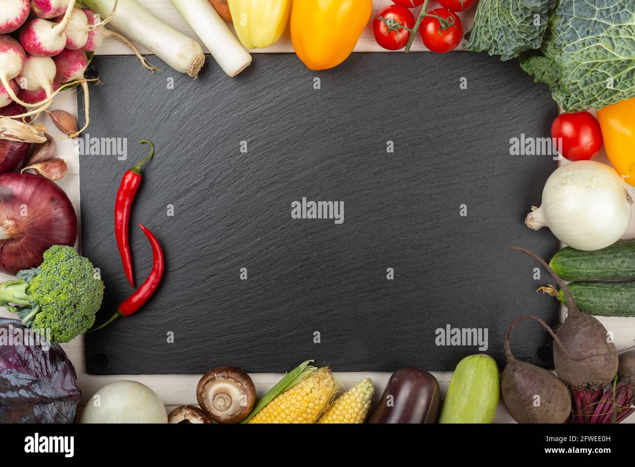 Organic food frame. Fresh raw vegetables from the home garden. On a ...