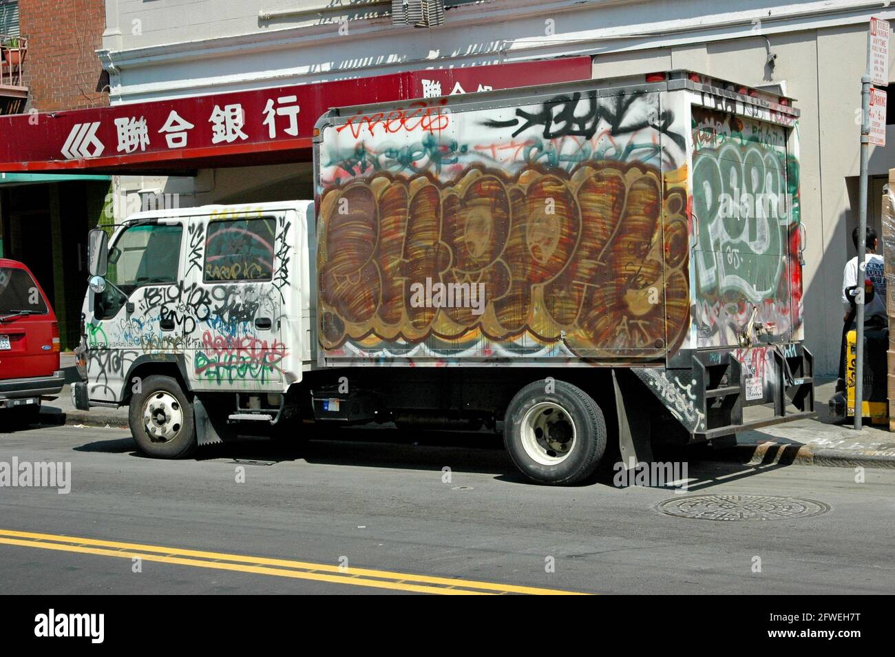 A delivery truck covered in spray painted street art graffiti on the ...