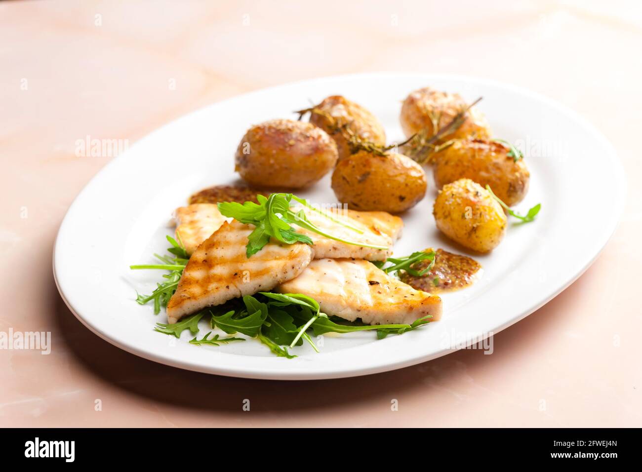 Still lifegrilled cod with potatoes Stock Photo - Alamy