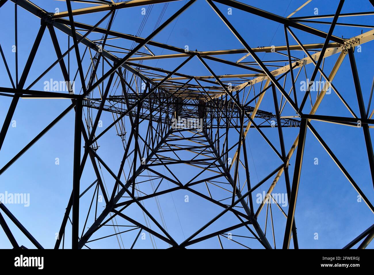 The structure of the power mast seen from the inside Stock Photo - Alamy