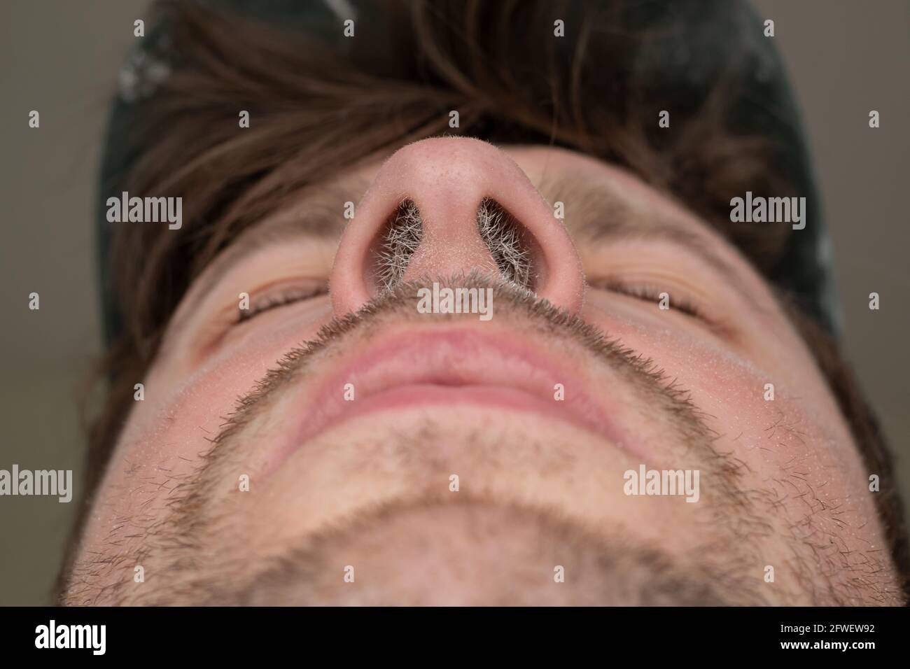 Dust and powder in nostrils of male constructor Stock Photo - Alamy