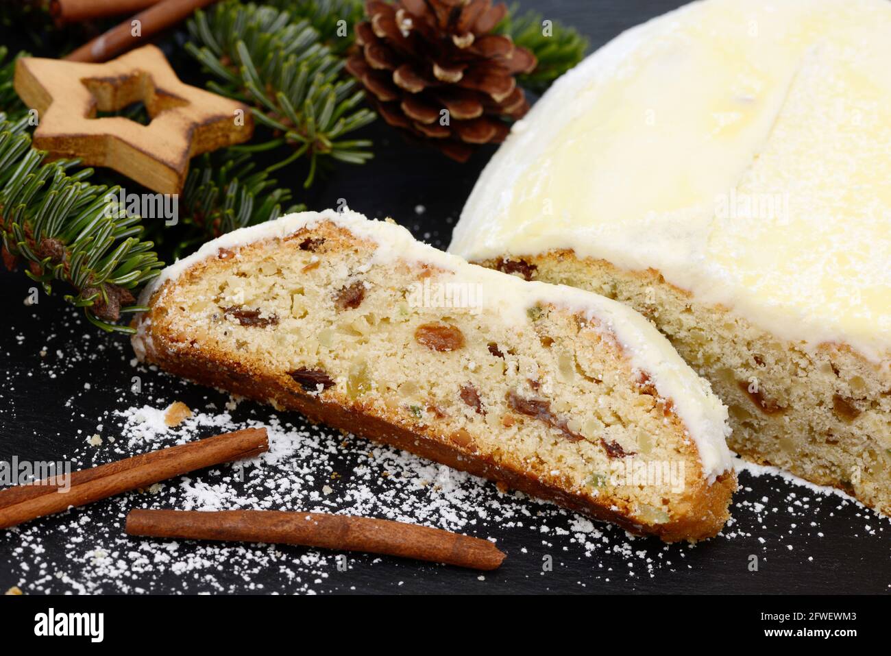 christmas stollen with fir branch, pine cone, stars and cinnemon sticks ...