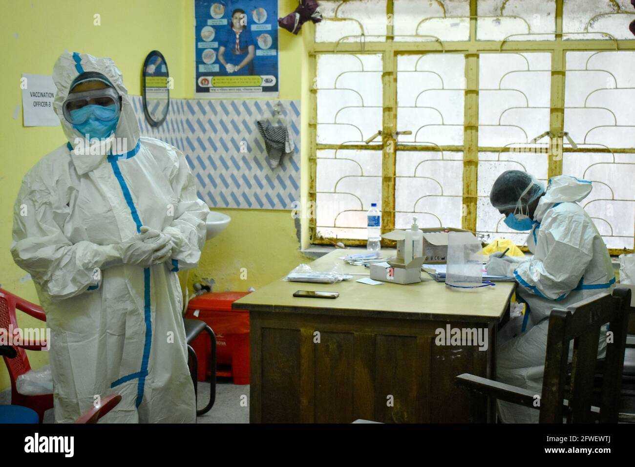 Healthcare workers are wearing PPE (Personal protective equipment) and ...