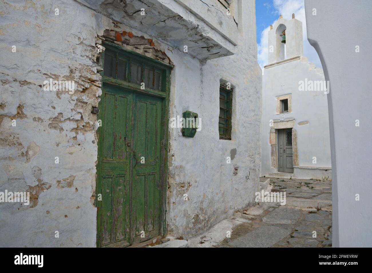 Rural landscape with a picturesque whitewashed Greek Orthodox chapel ...