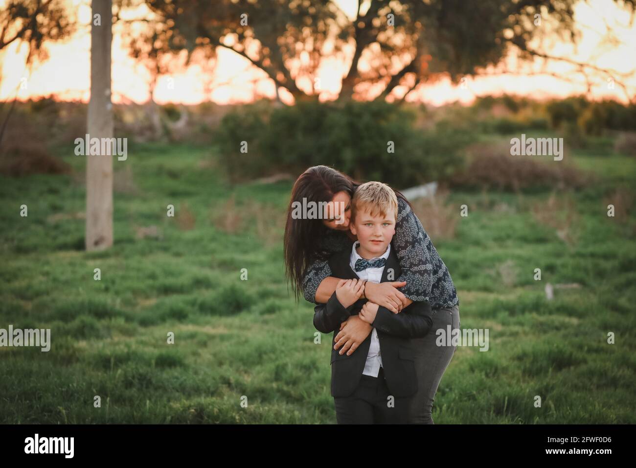 Scenic view of a white Caucasian woman hugging her son Stock Photo - Alamy