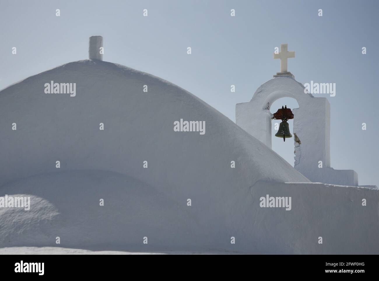 Landscape with scenic view of a traditional whitewashed Greek Orthodox ...
