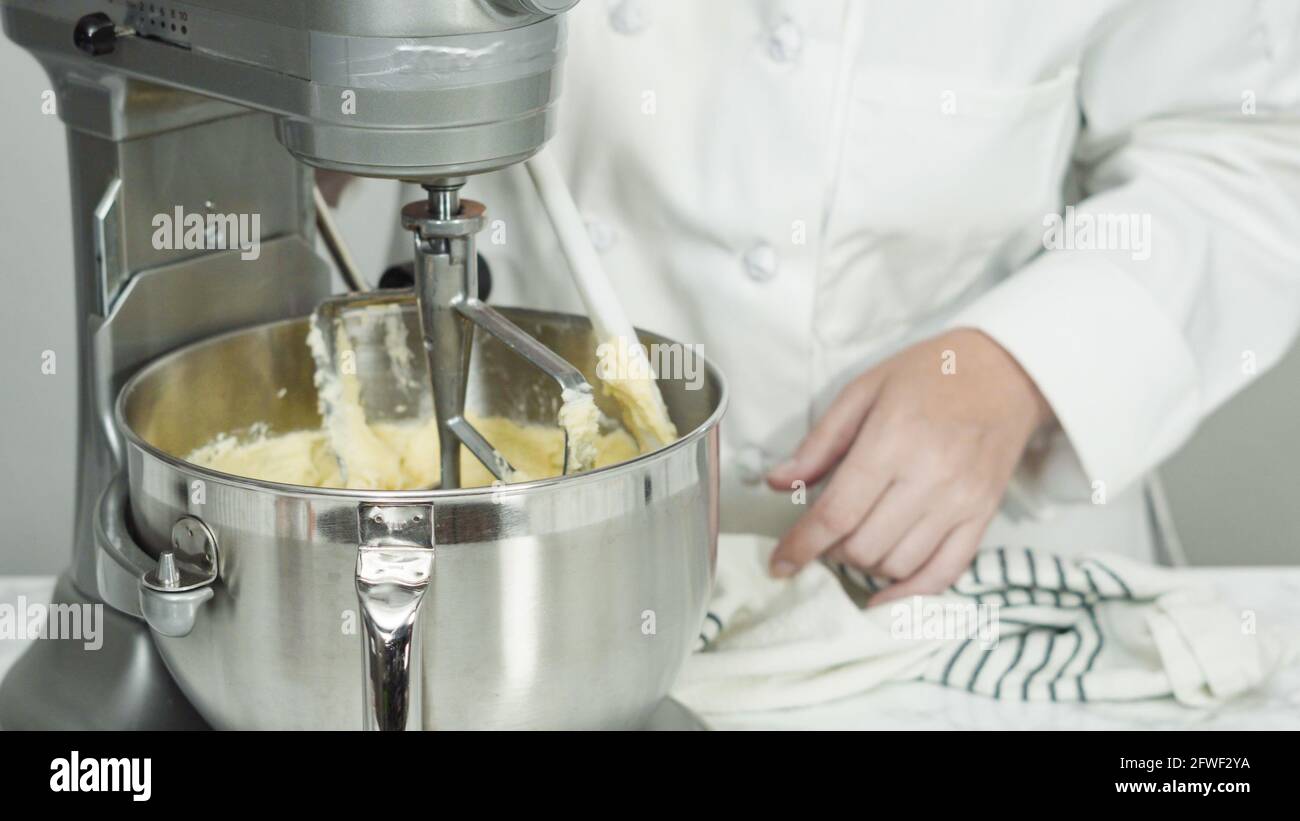Step by step. Mixing ingredients in standing kitchen mixer to bake ...