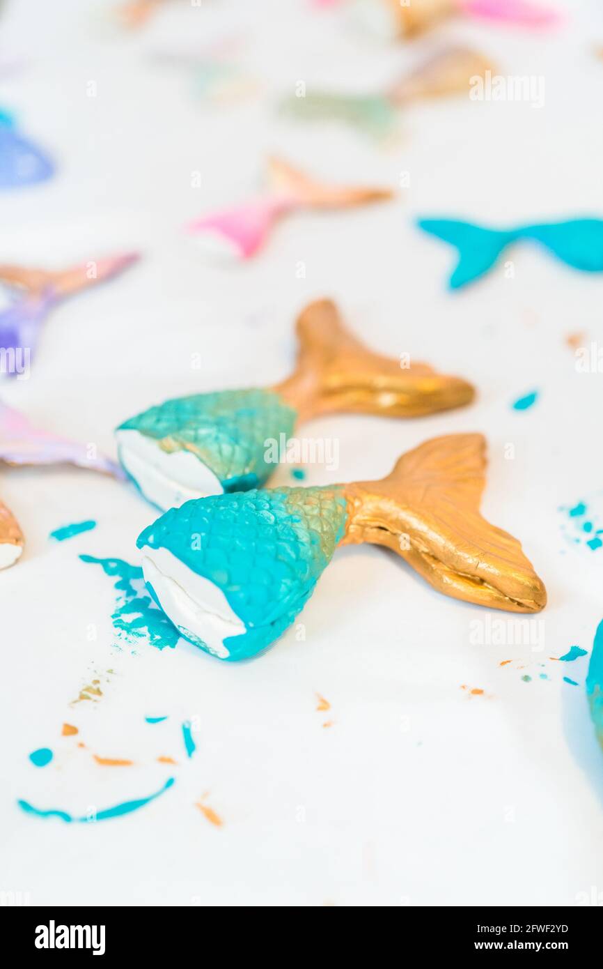 Mermaid tails made out of modeling clay and painted with acrylic paint ...