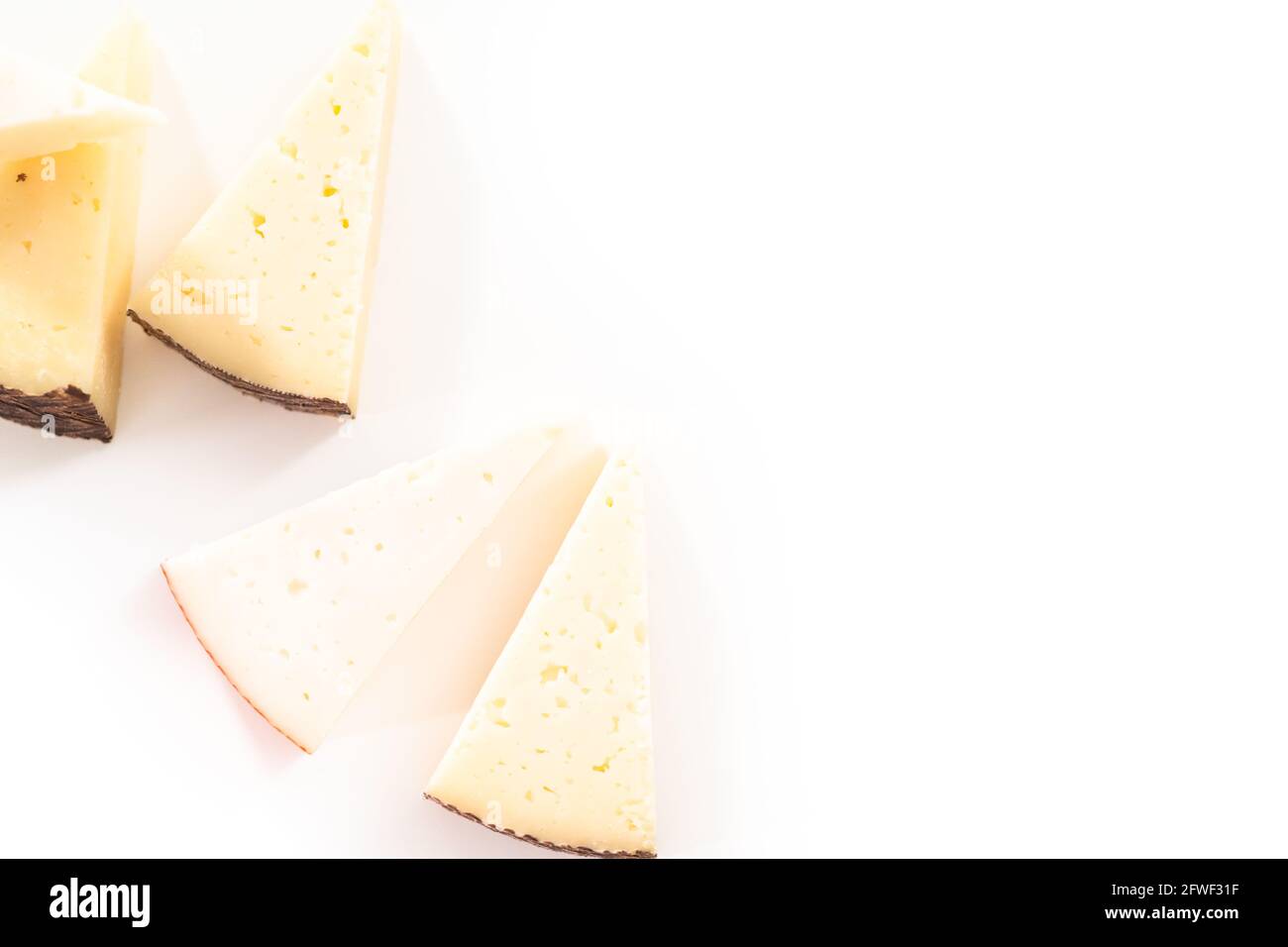 Variety of large wedges gourmet cheese on a white background Stock ...