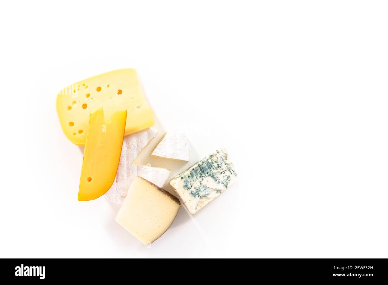 Variety of large wedges gourmet cheese on a white background Stock ...